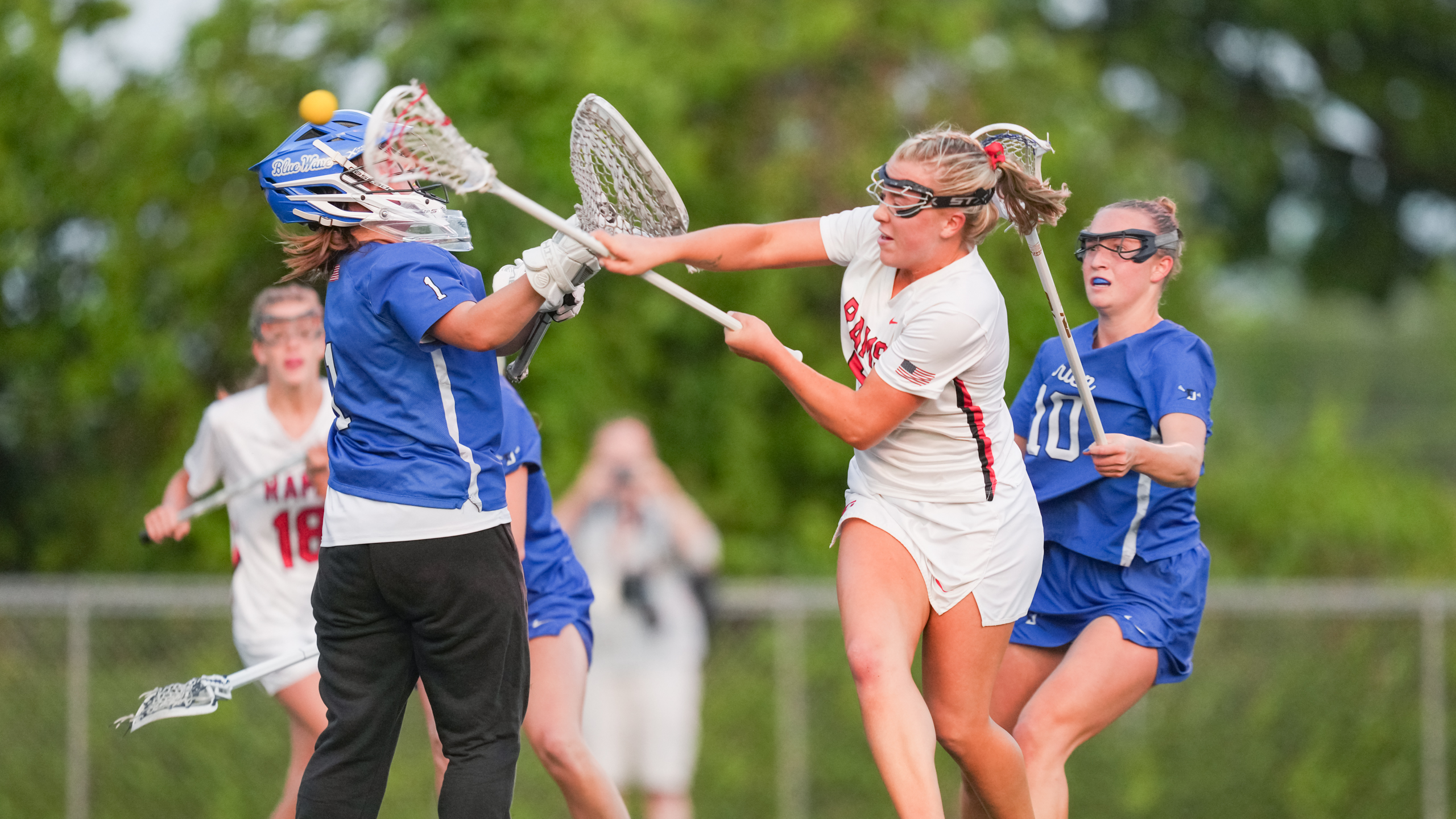 New Canaan’s Devon Russell fakes out Darien goalie Hope Schoudel and ...