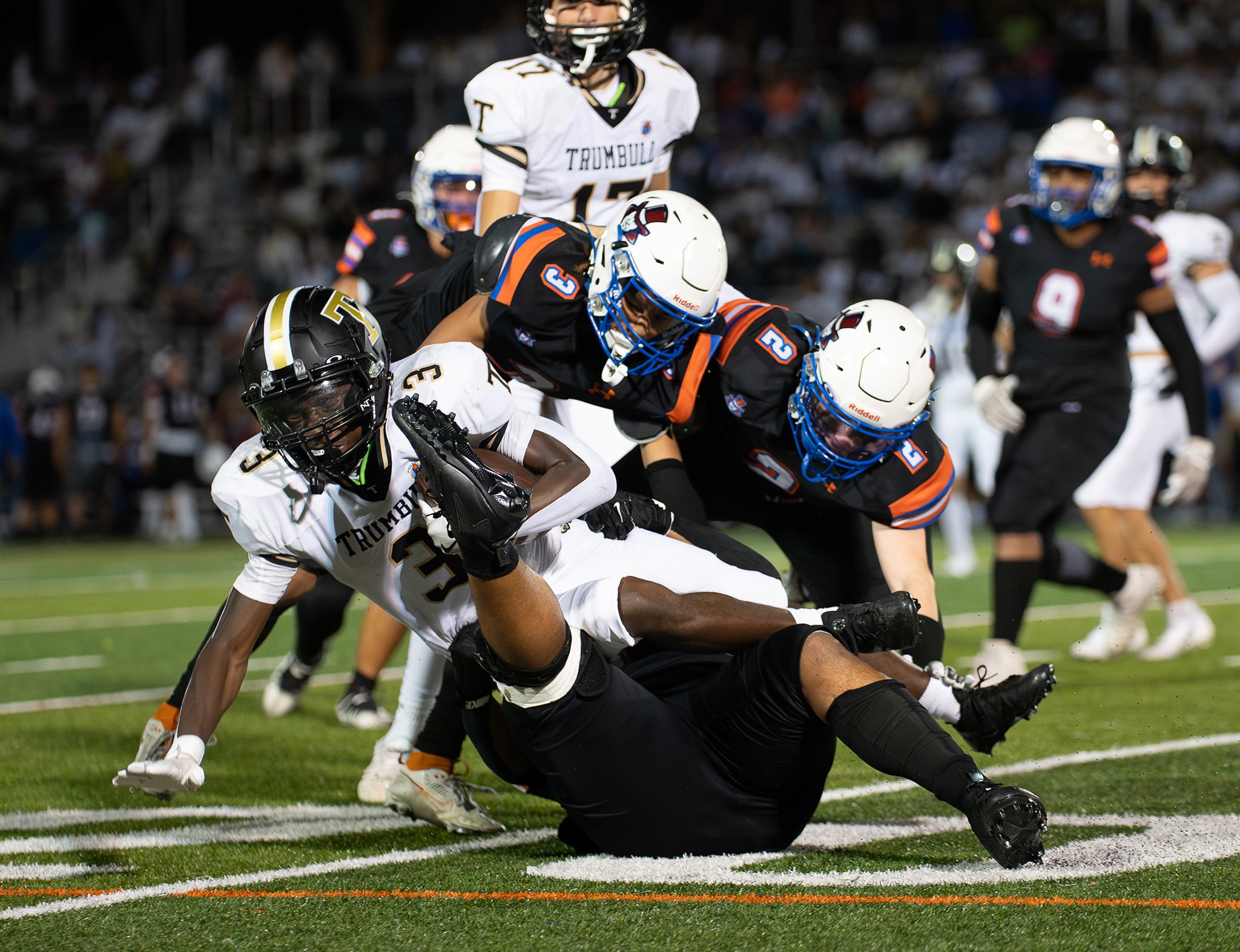 Trumbull's Jaden Tuhaise is stopped after a short gain. (David G ...