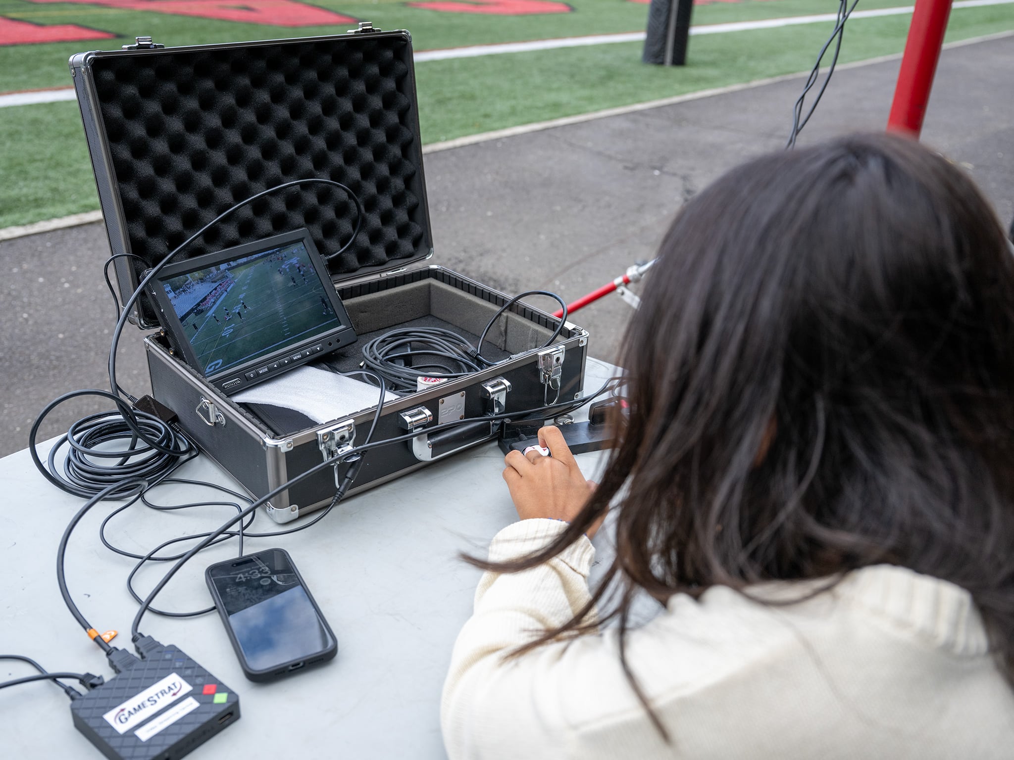 New Canaan's Anabel James controls the end zone camera. (David G ...